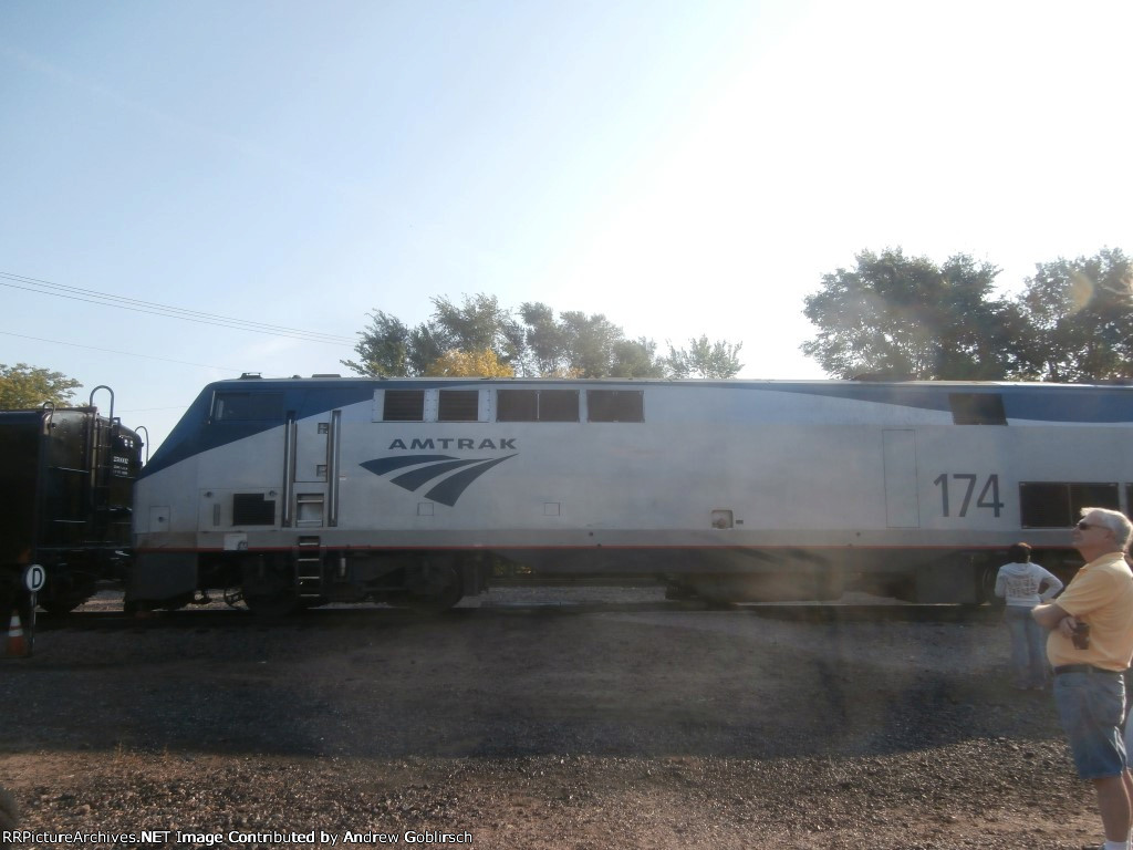 AMTK 174 moving behind 250002 & 261